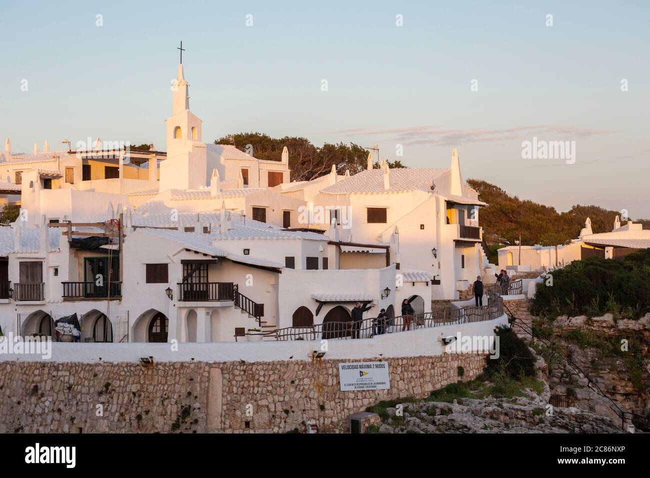 The whitewash fishing village of Binibeca Vell at sunset, Menorca Stock ...