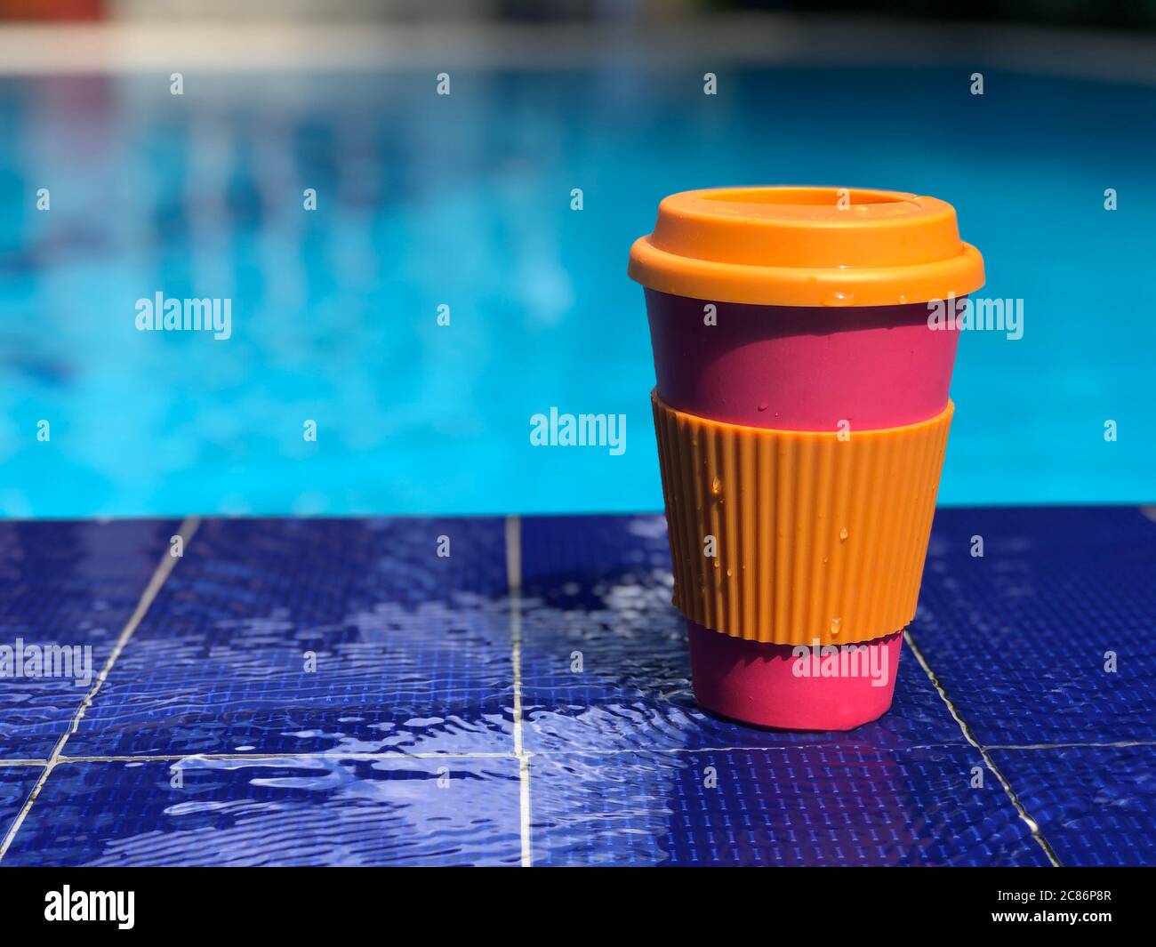 reusable bamboo mug at the swimming pool Stock Photo - Alamy