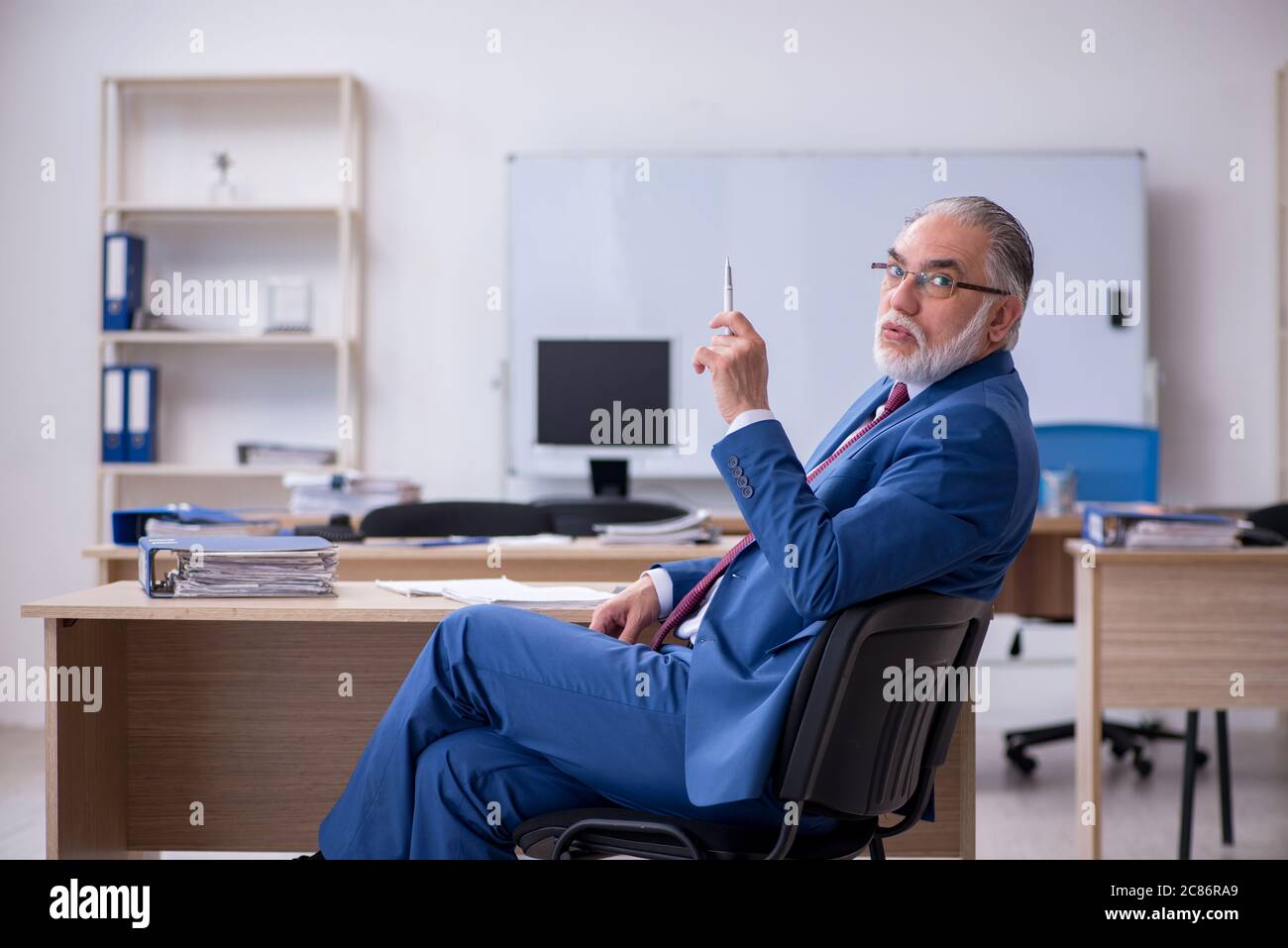 Male boss employee working in the office Stock Photo - Alamy