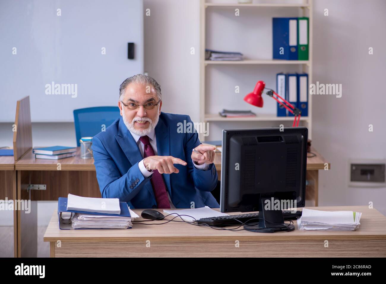 Male boss employee working in the office Stock Photo - Alamy