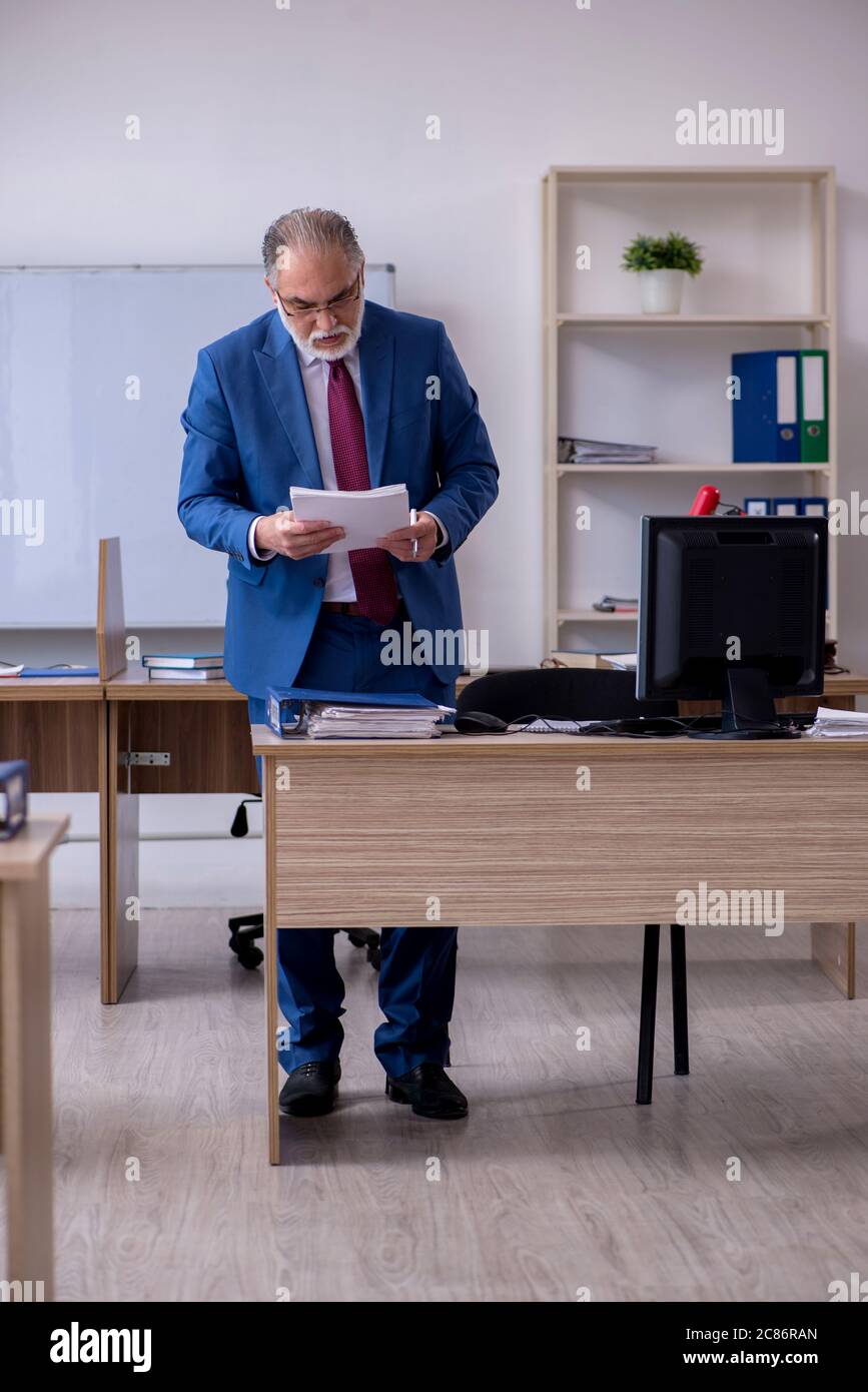 Male boss employee working in the office Stock Photo - Alamy