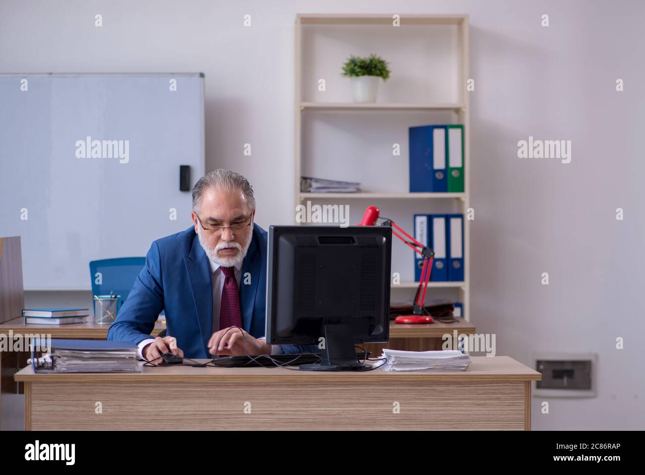 Male boss employee working in the office Stock Photo - Alamy