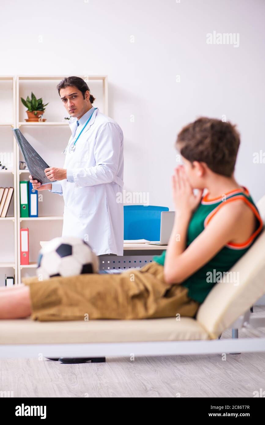 Sick boy visiting young doctor pediatrician Stock Photo - Alamy