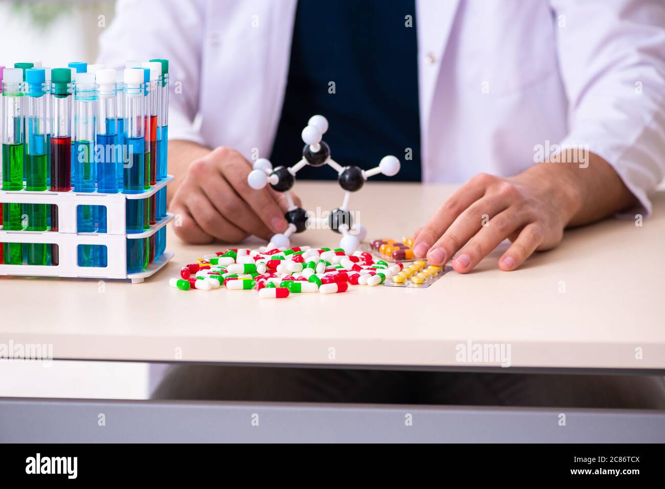 Young scientist sitting in the classroom Stock Photo - Alamy