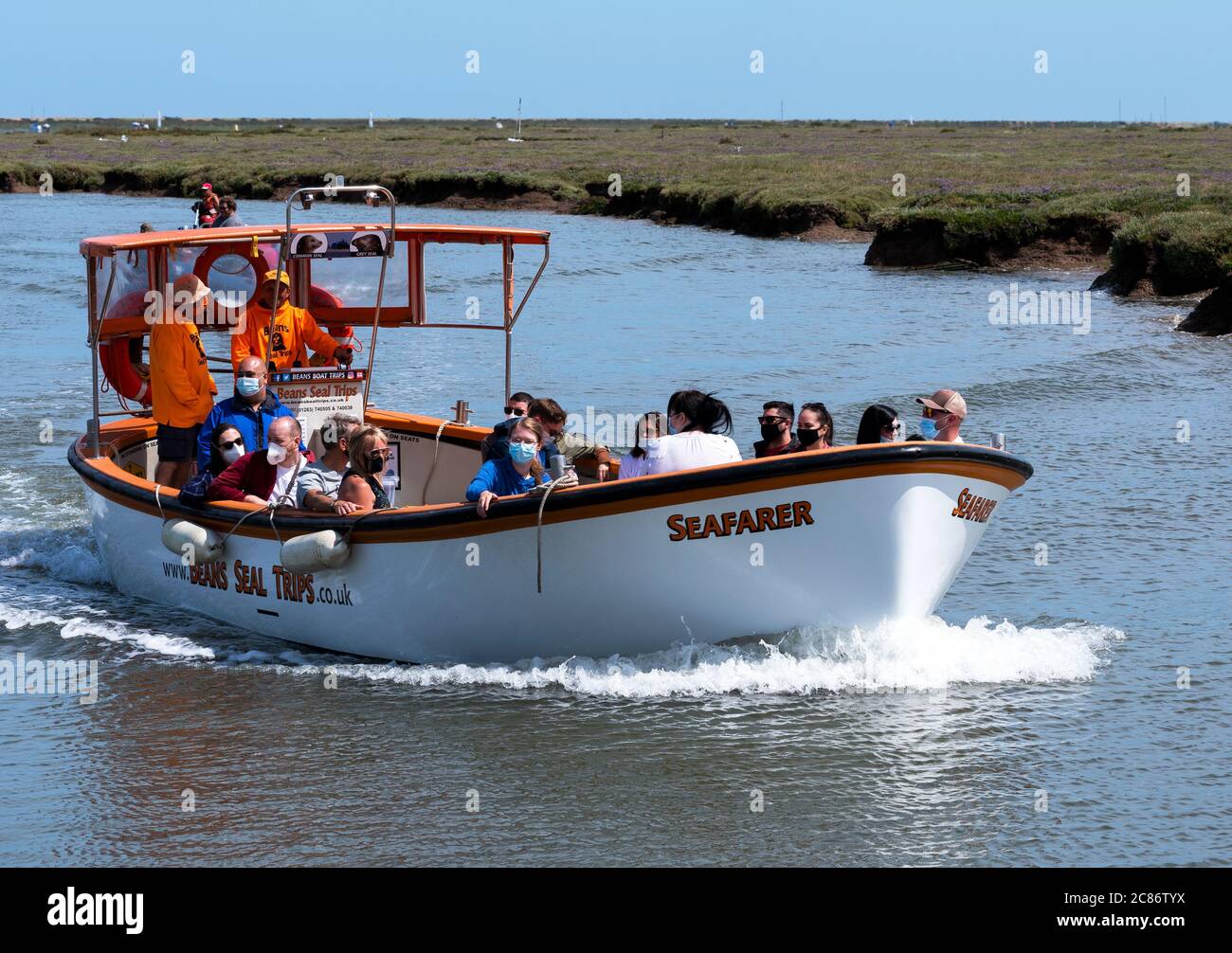 Morston Quay, Norfolk, UK. Beans Seal Trip boat returning to its ...