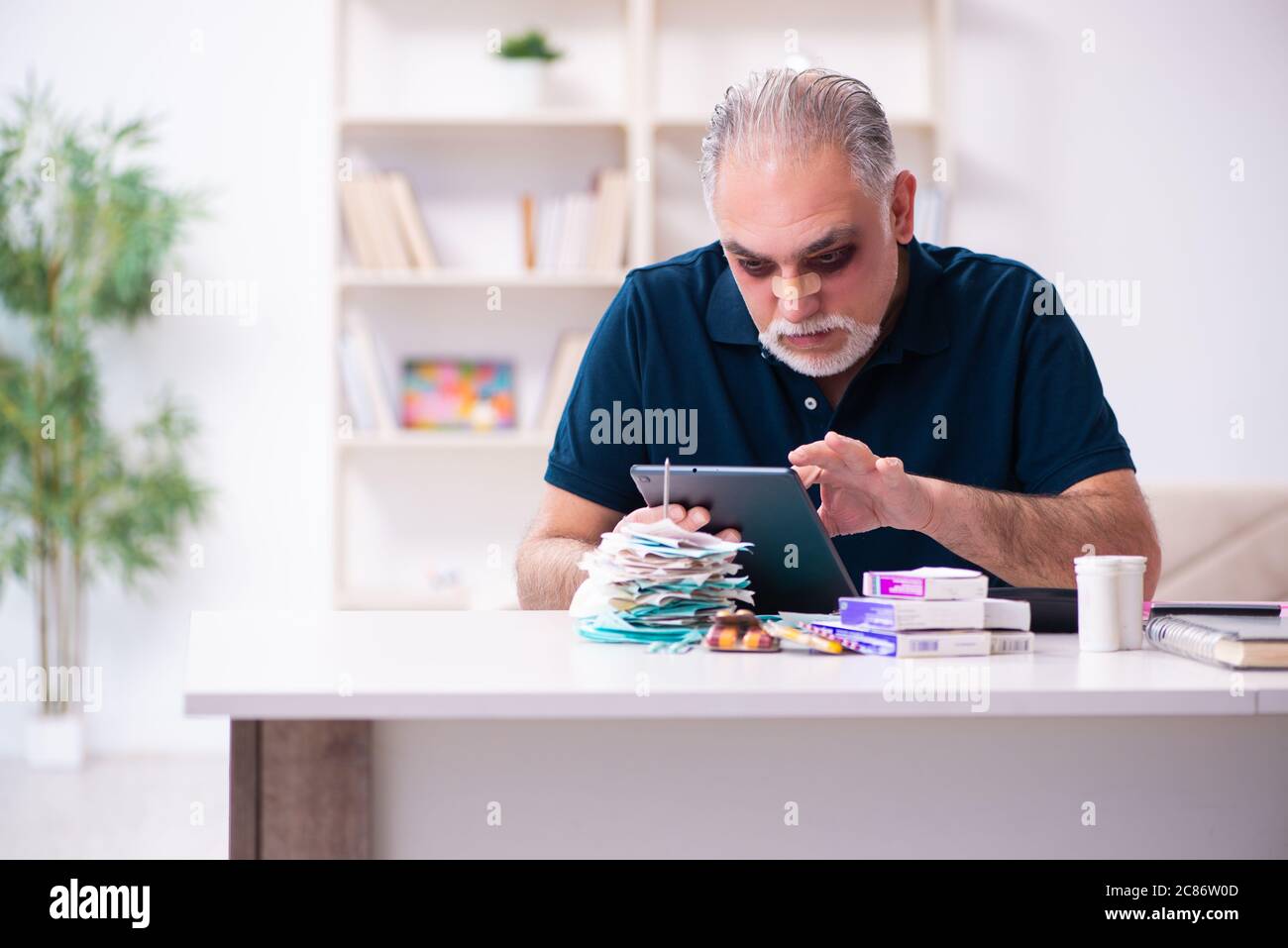 Old man in budget planning concept Stock Photo - Alamy