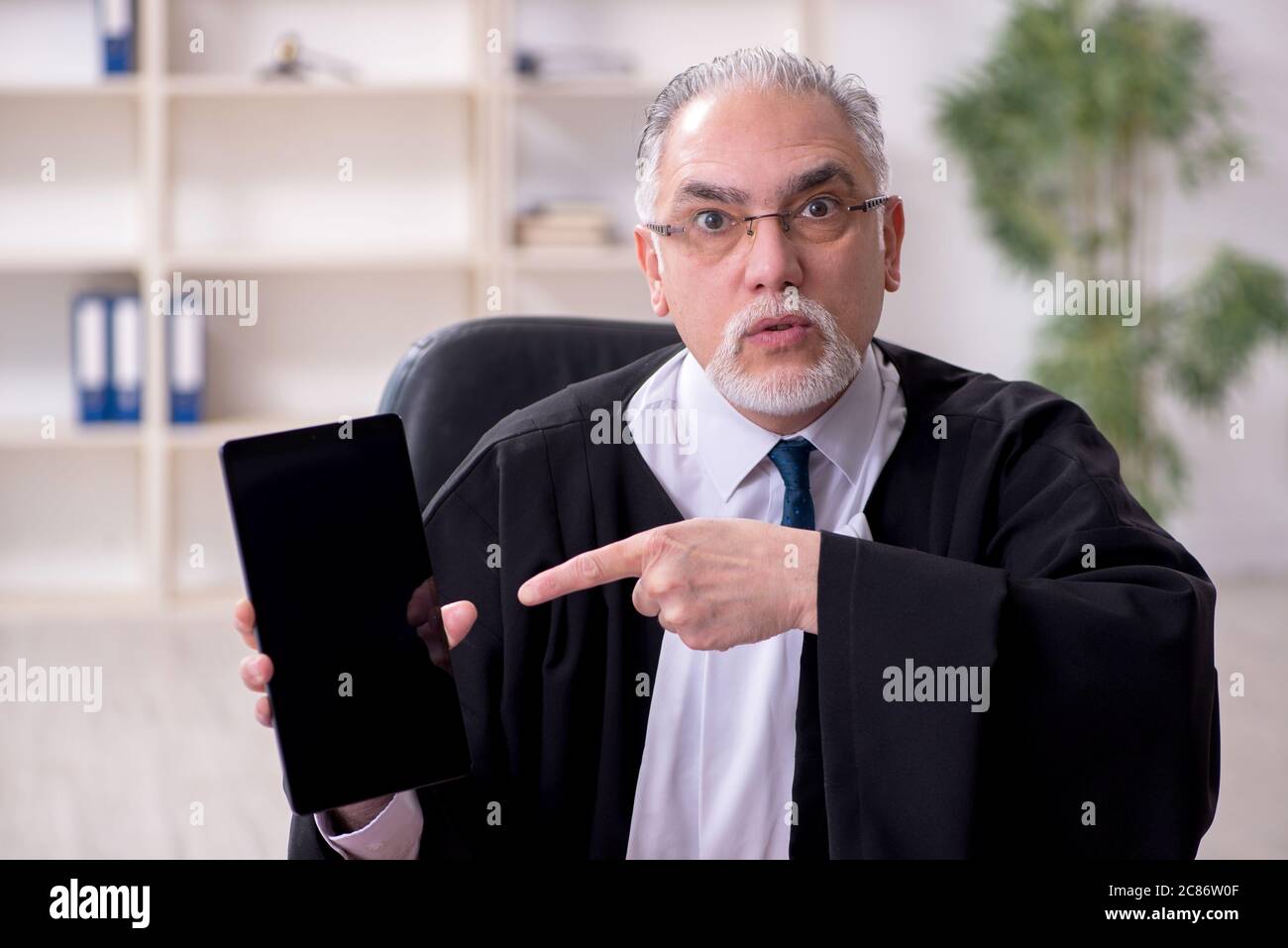Old judge working in courthouse Stock Photo - Alamy