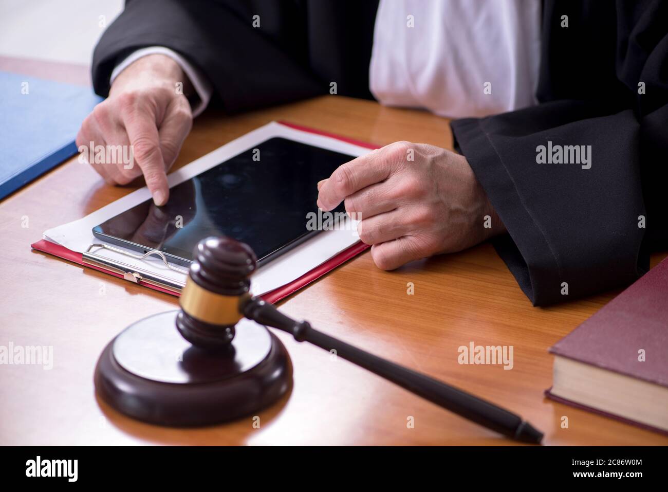 Old judge working in courthouse Stock Photo - Alamy