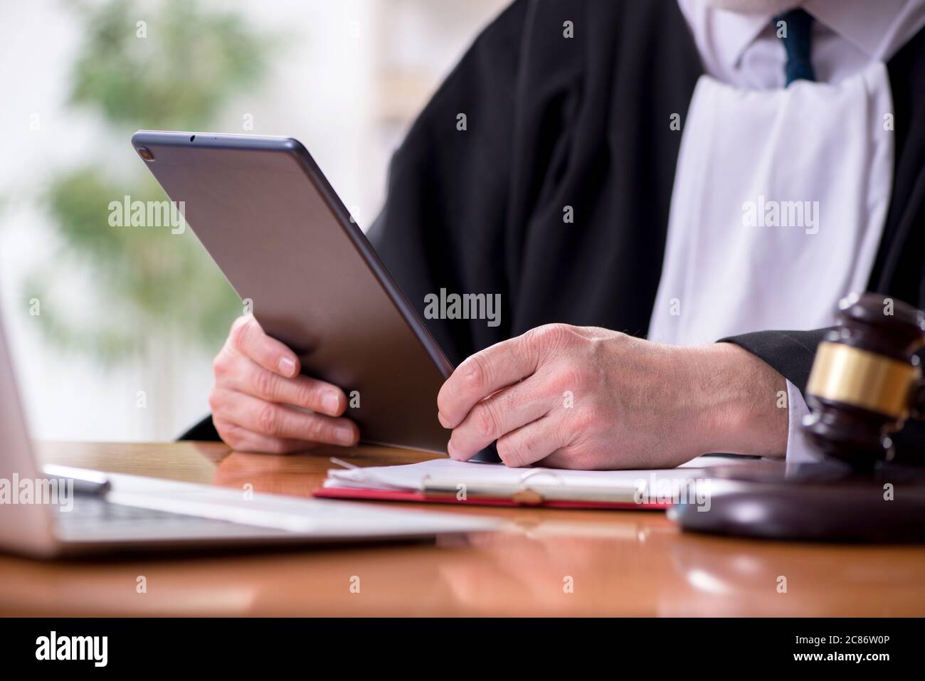 Old judge working in courthouse Stock Photo - Alamy