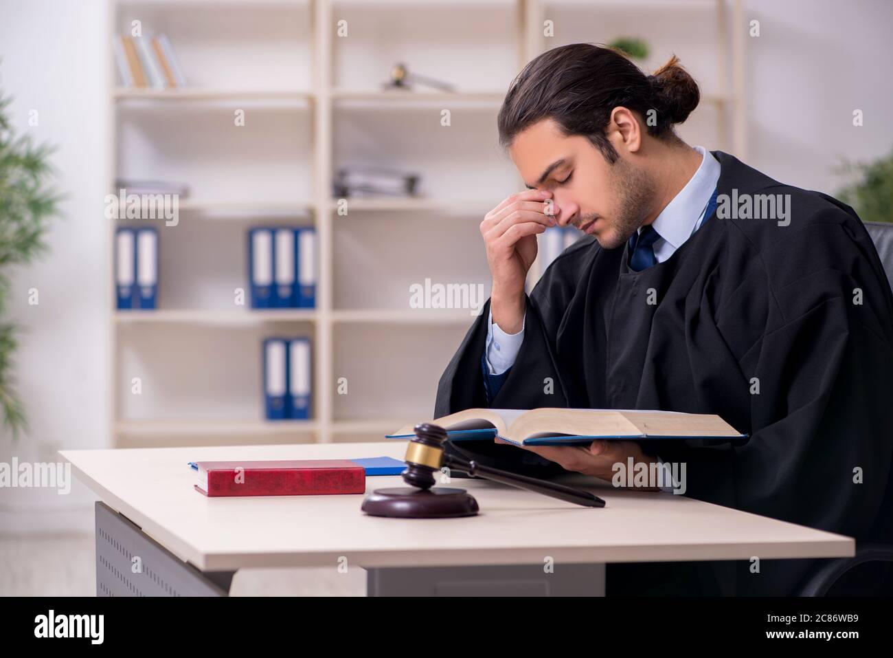 Young judge working in courthouse Stock Photo - Alamy