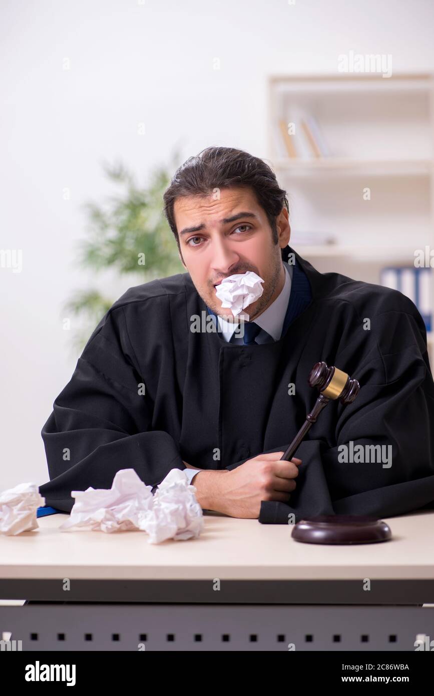 Young judge working in courthouse Stock Photo - Alamy