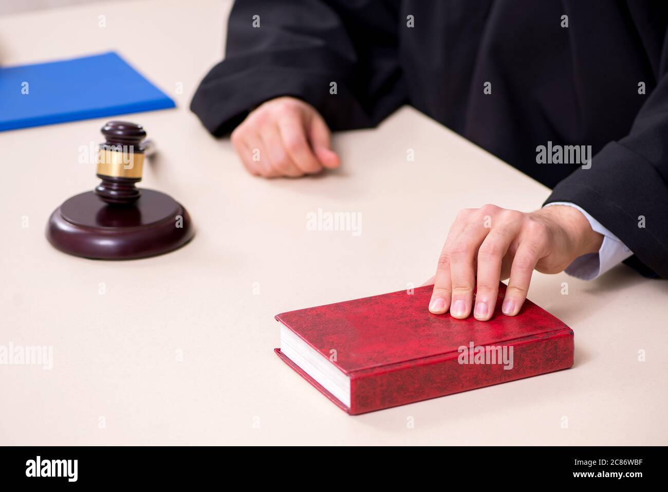 Young judge working in courthouse Stock Photo - Alamy