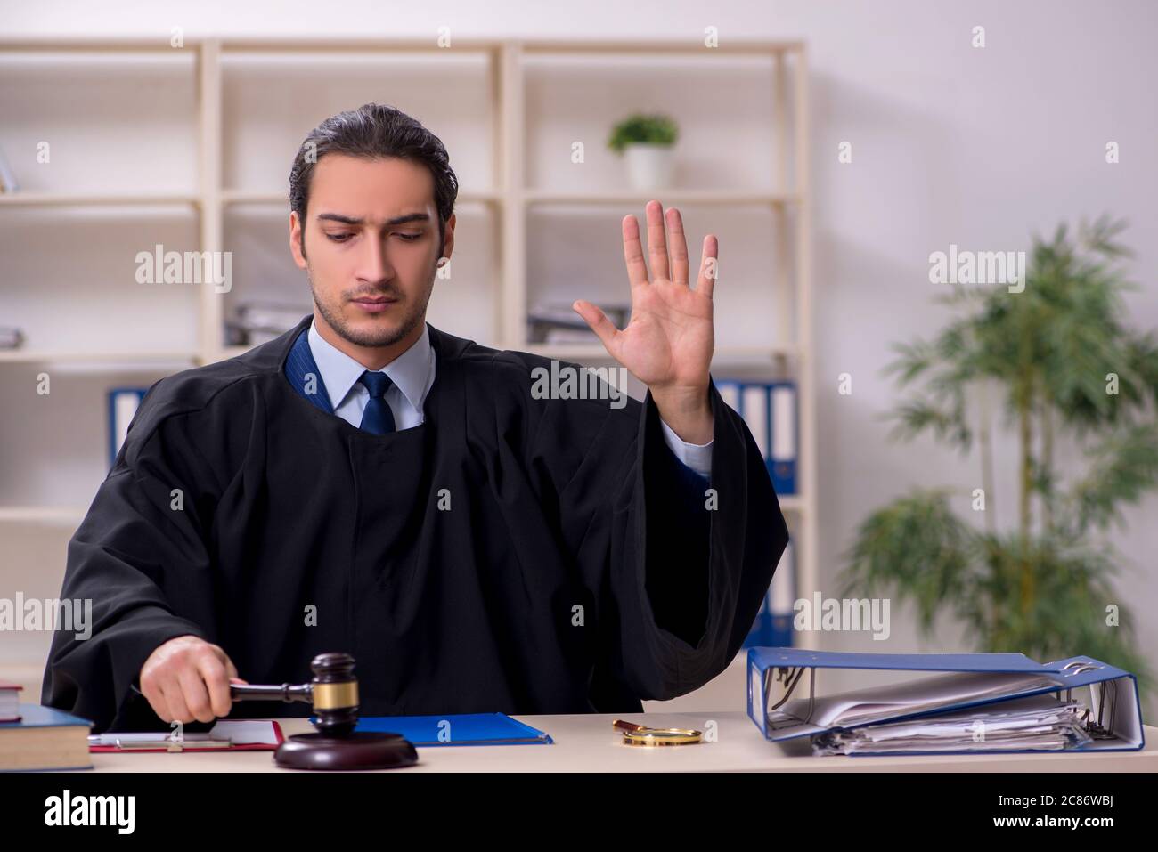 Young judge working in courthouse Stock Photo - Alamy