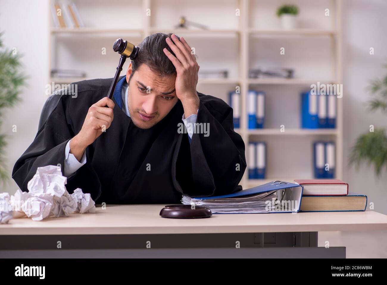 Young judge working in courthouse Stock Photo - Alamy