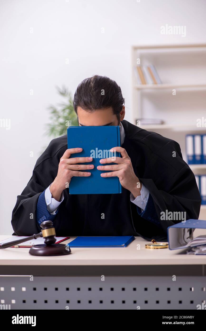 Young judge working in courthouse Stock Photo - Alamy