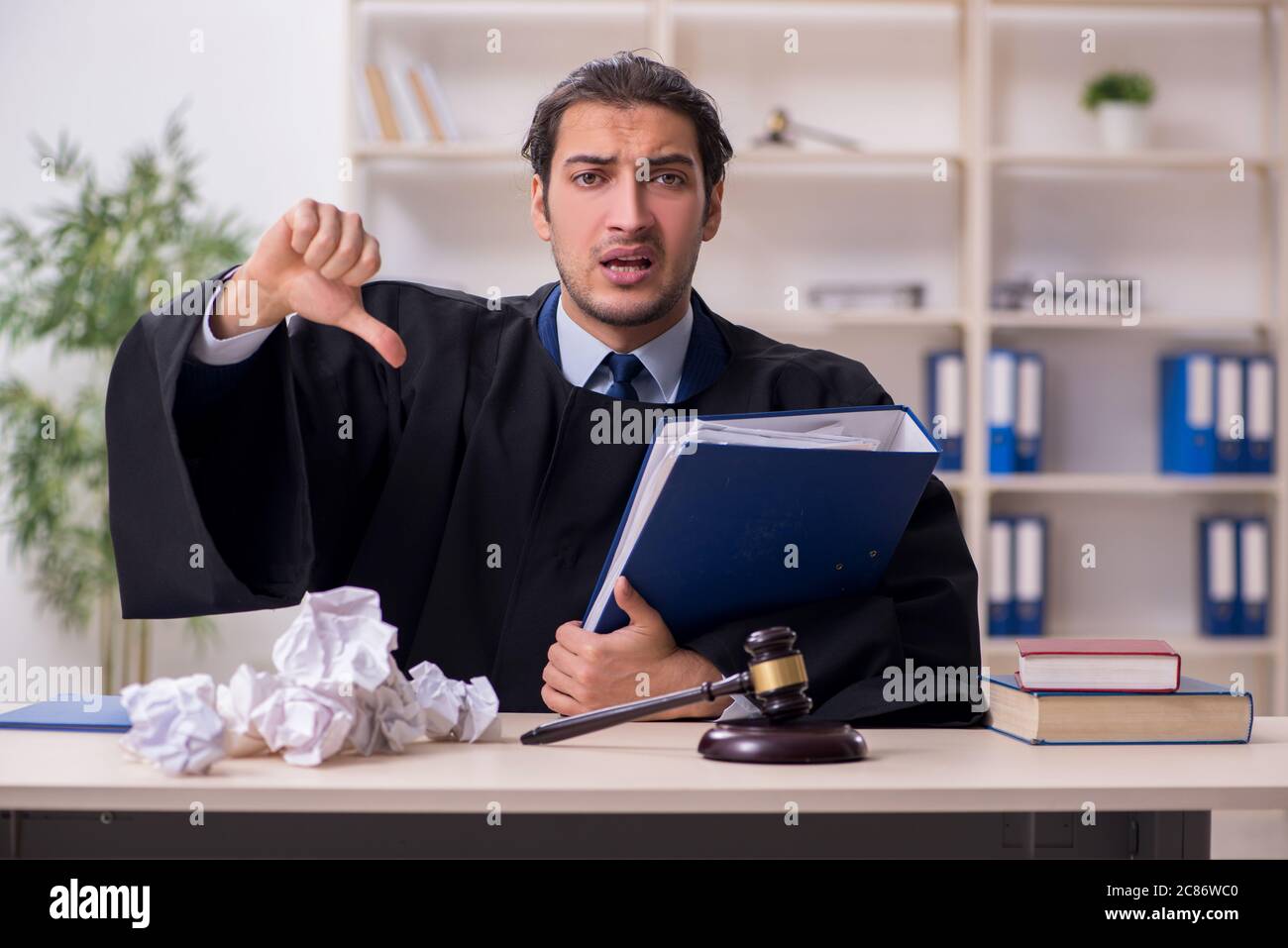 Young judge working in courthouse Stock Photo - Alamy