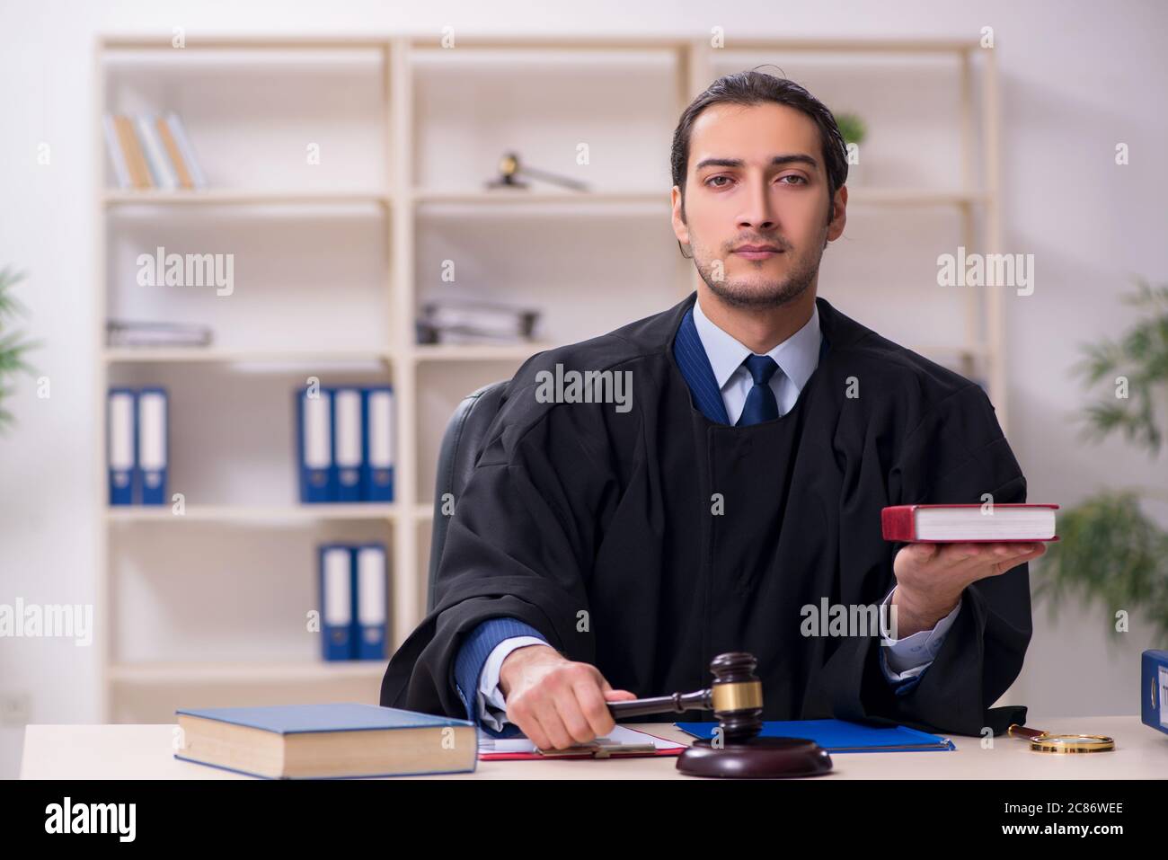 Young judge working in courthouse Stock Photo - Alamy