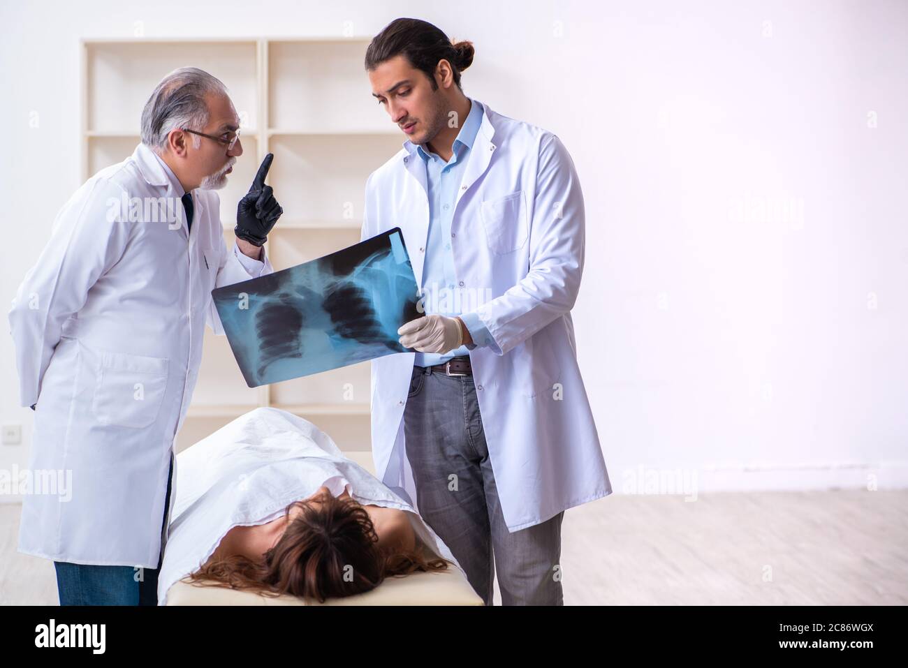 Police coroner examining dead body corpse in the morgue Stock Photo - Alamy
