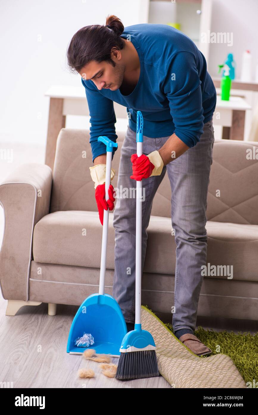 Young man husband doing housework Stock Photo - Alamy