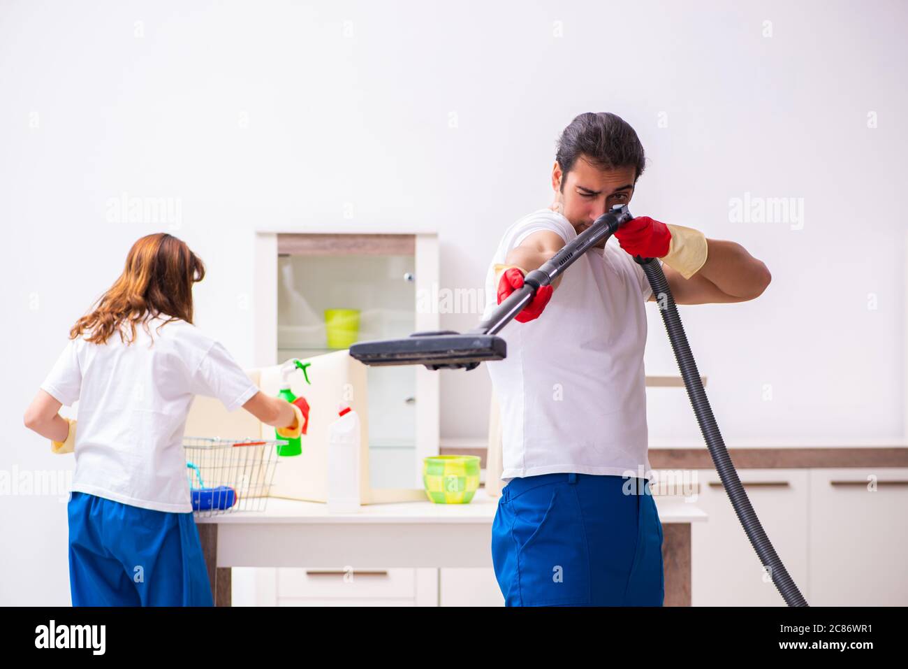 Young pair doing housework at the home Stock Photo - Alamy