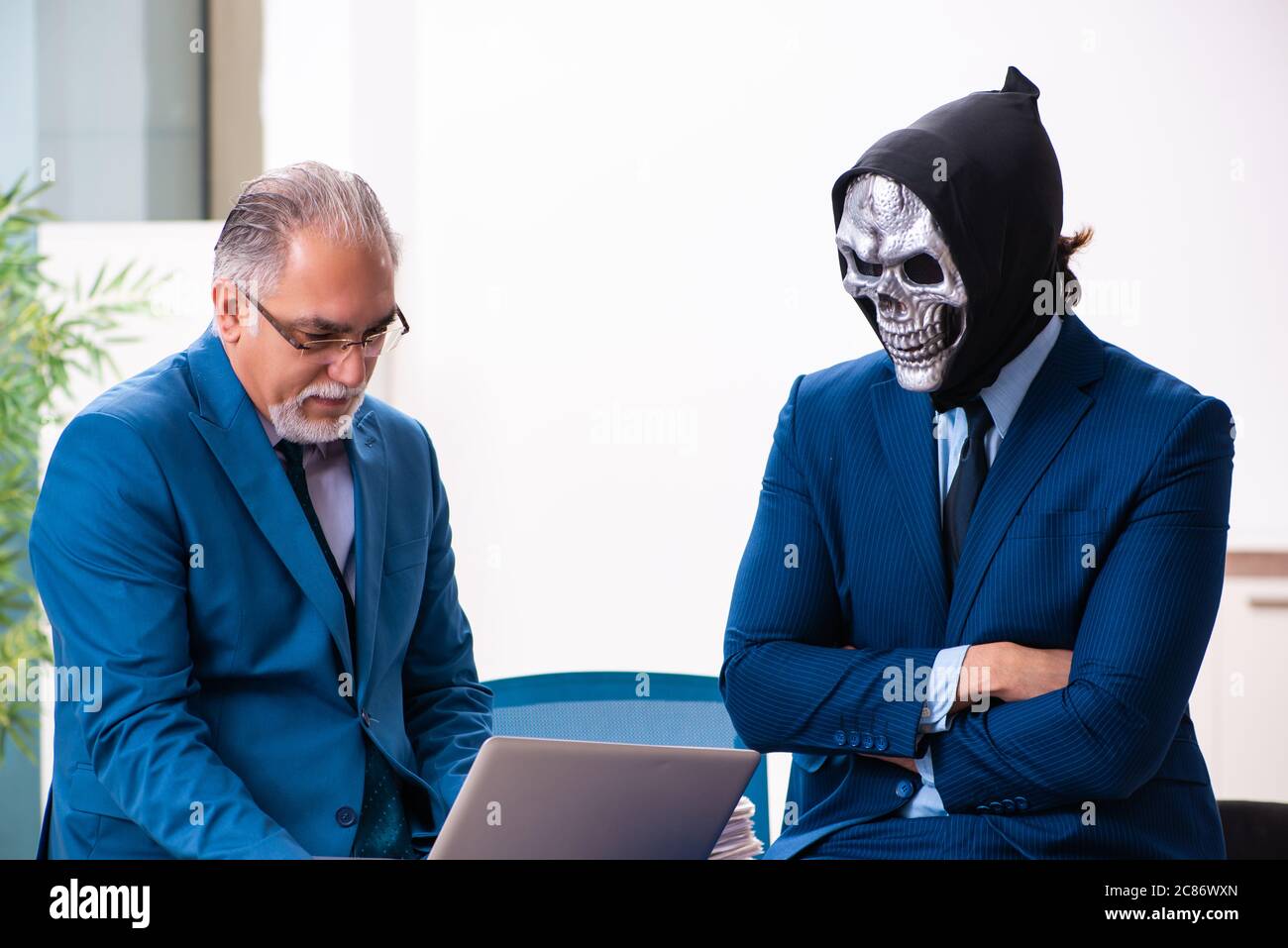 Old businessman employee making deal with the devil Stock Photo - Alamy