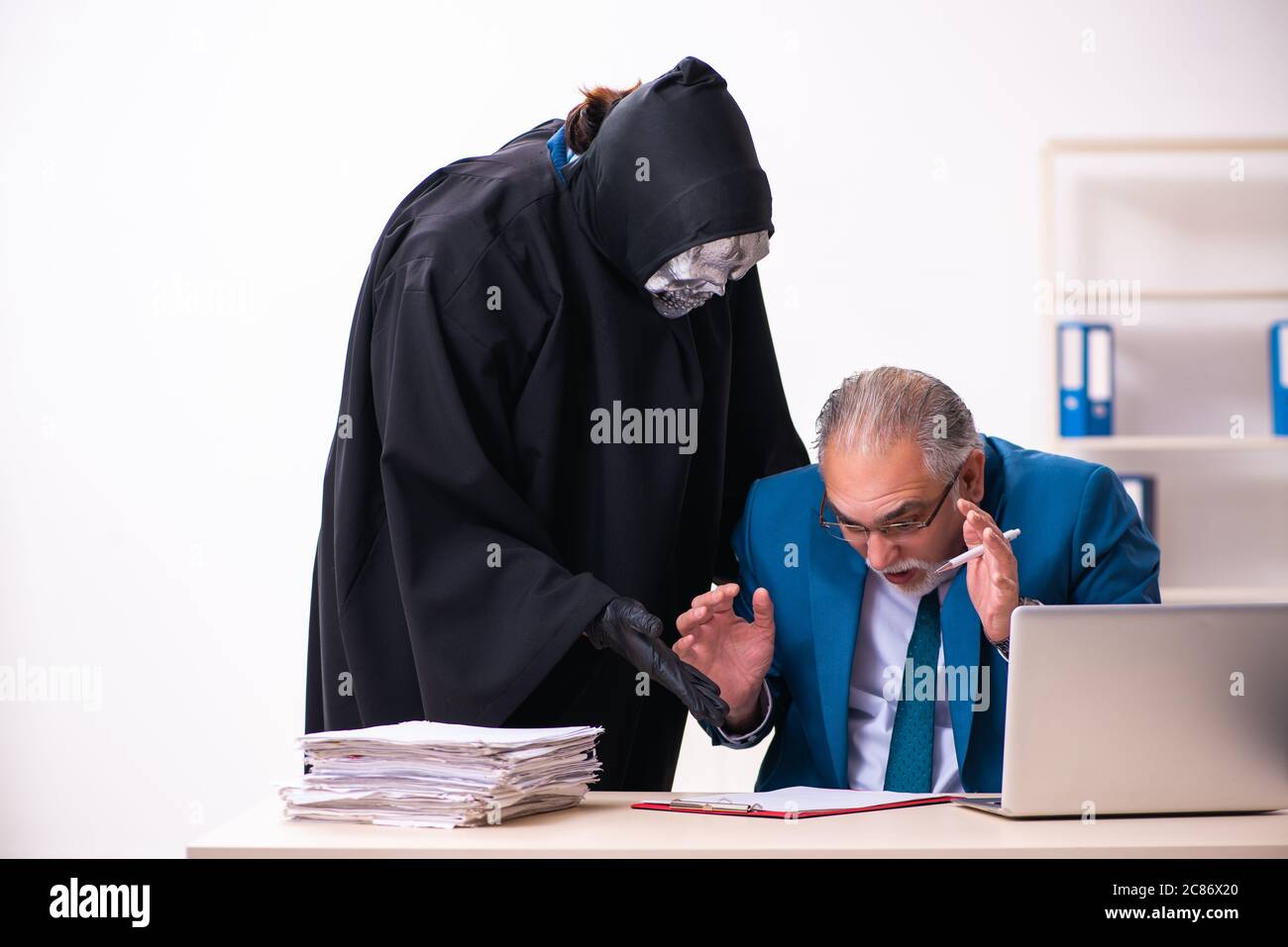 Old businessman employee making deal with the devil Stock Photo - Alamy