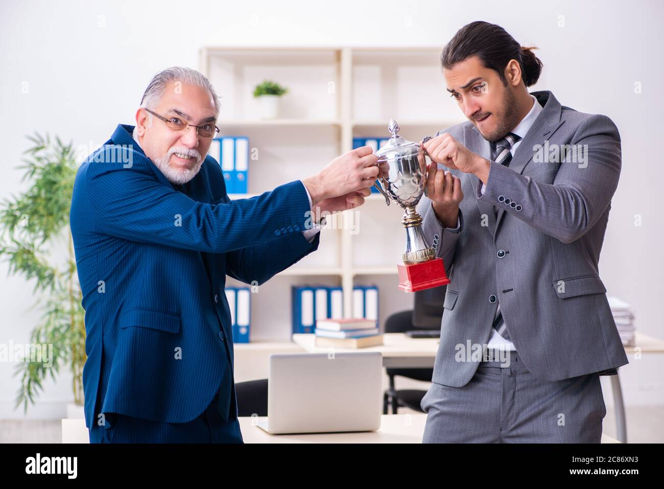 Two employees working in the office Stock Photo - Alamy