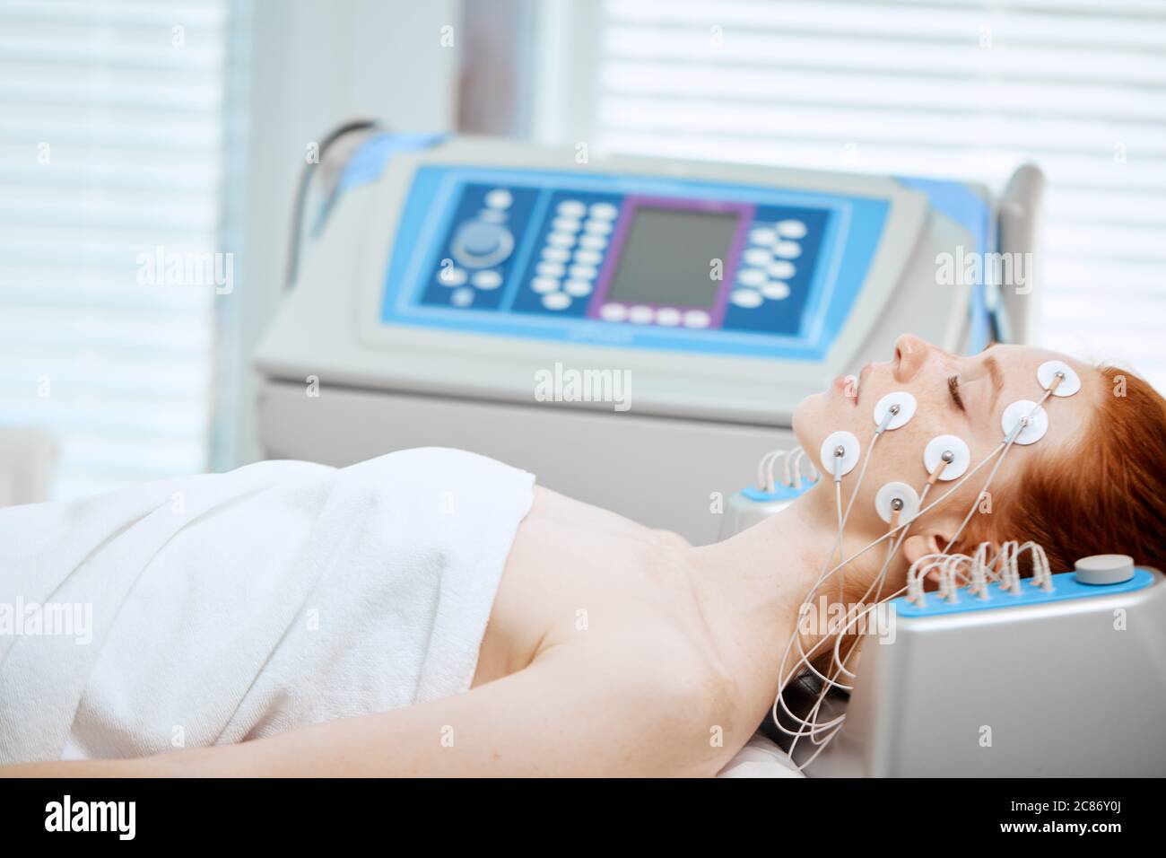 Cosmetology and Skin Care concept. Beautiful red haired woman At ...