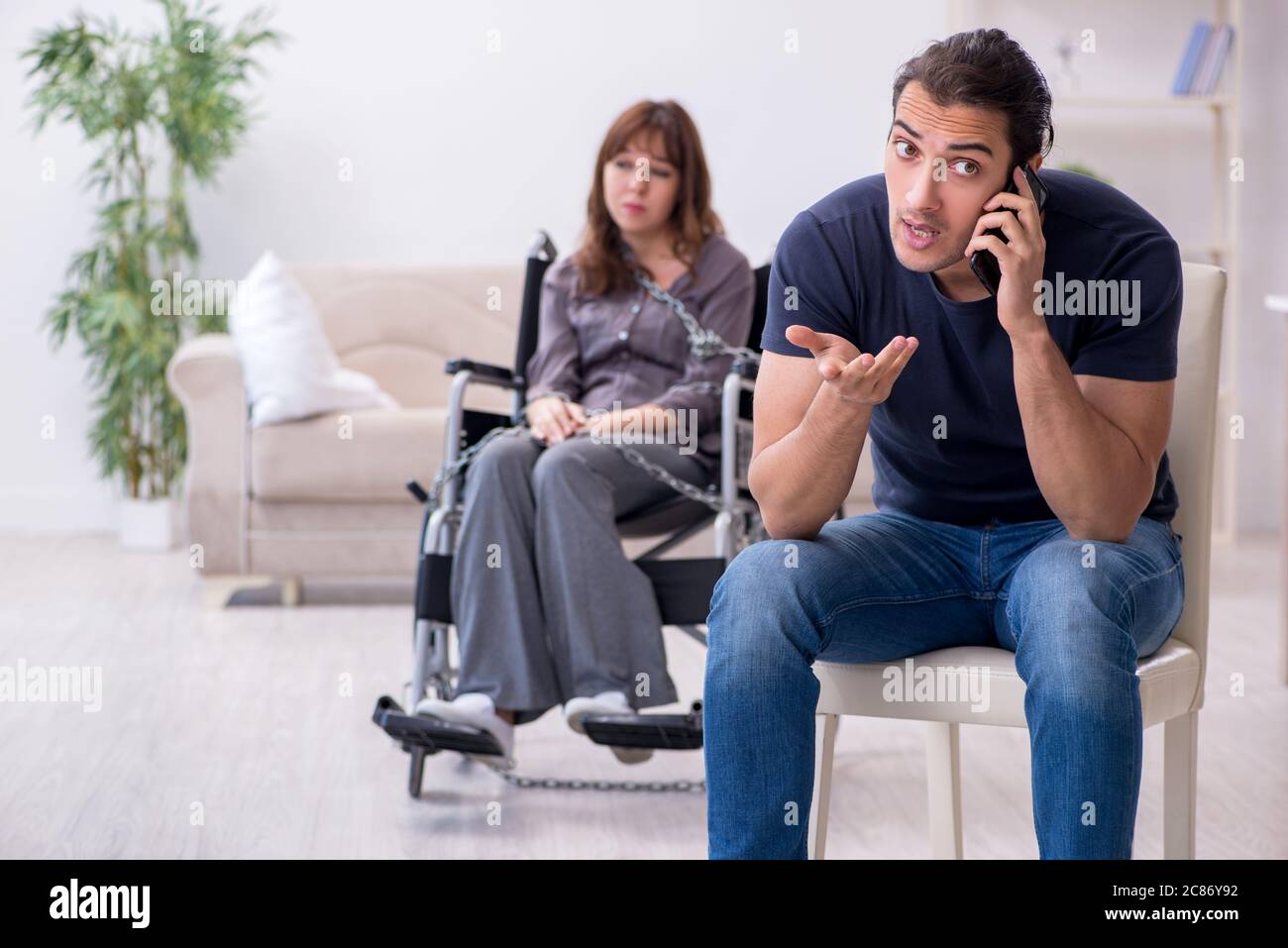 Disabled wife and husband at home Stock Photo - Alamy