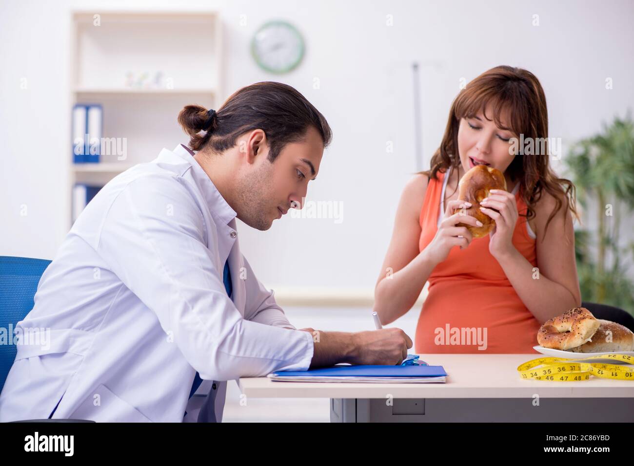 Pregnant woman visiting doctor gynecologist Stock Photo - Alamy