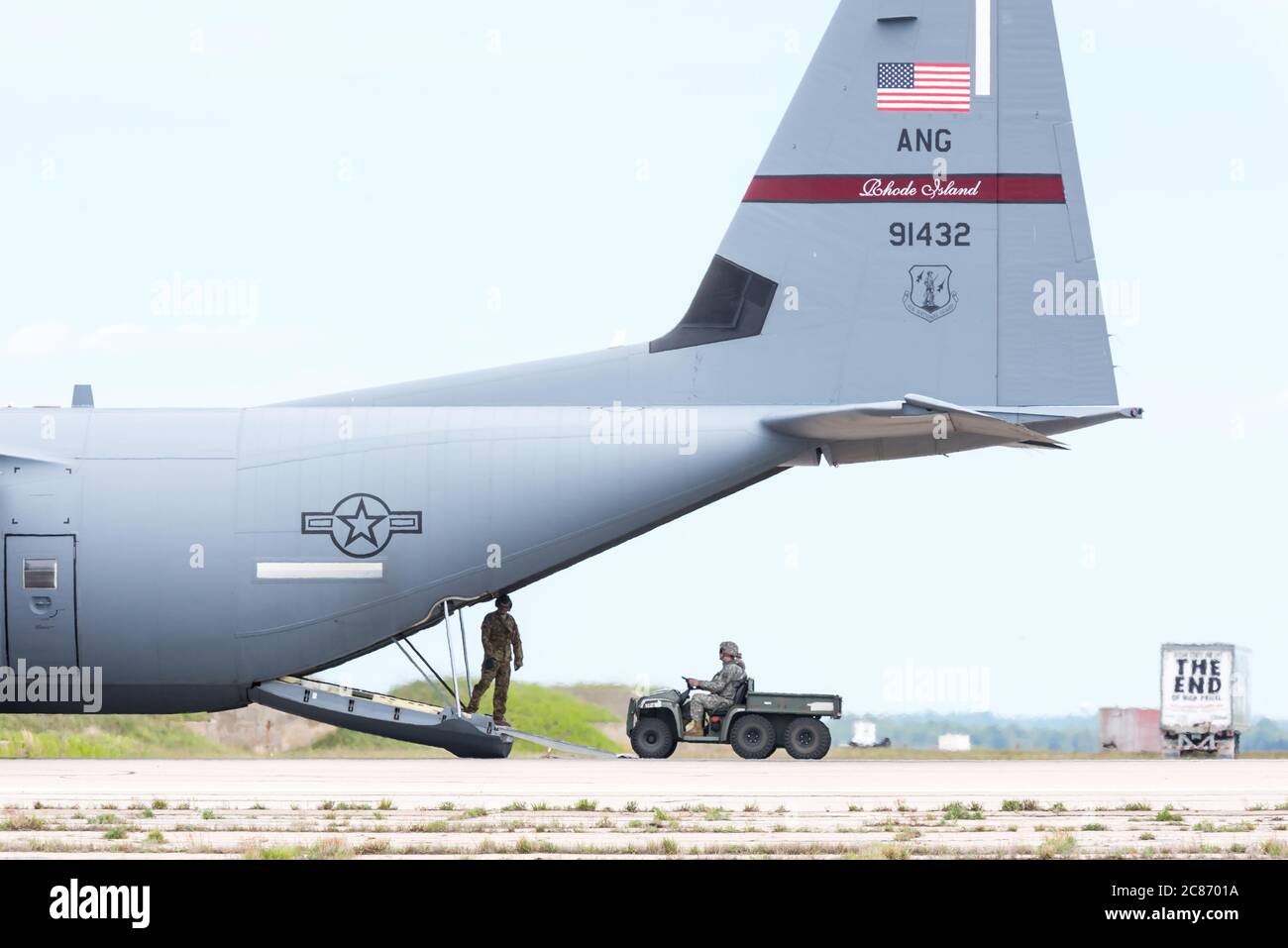 Soldier driving a jeep into the back end of a C-130 parked on the ...