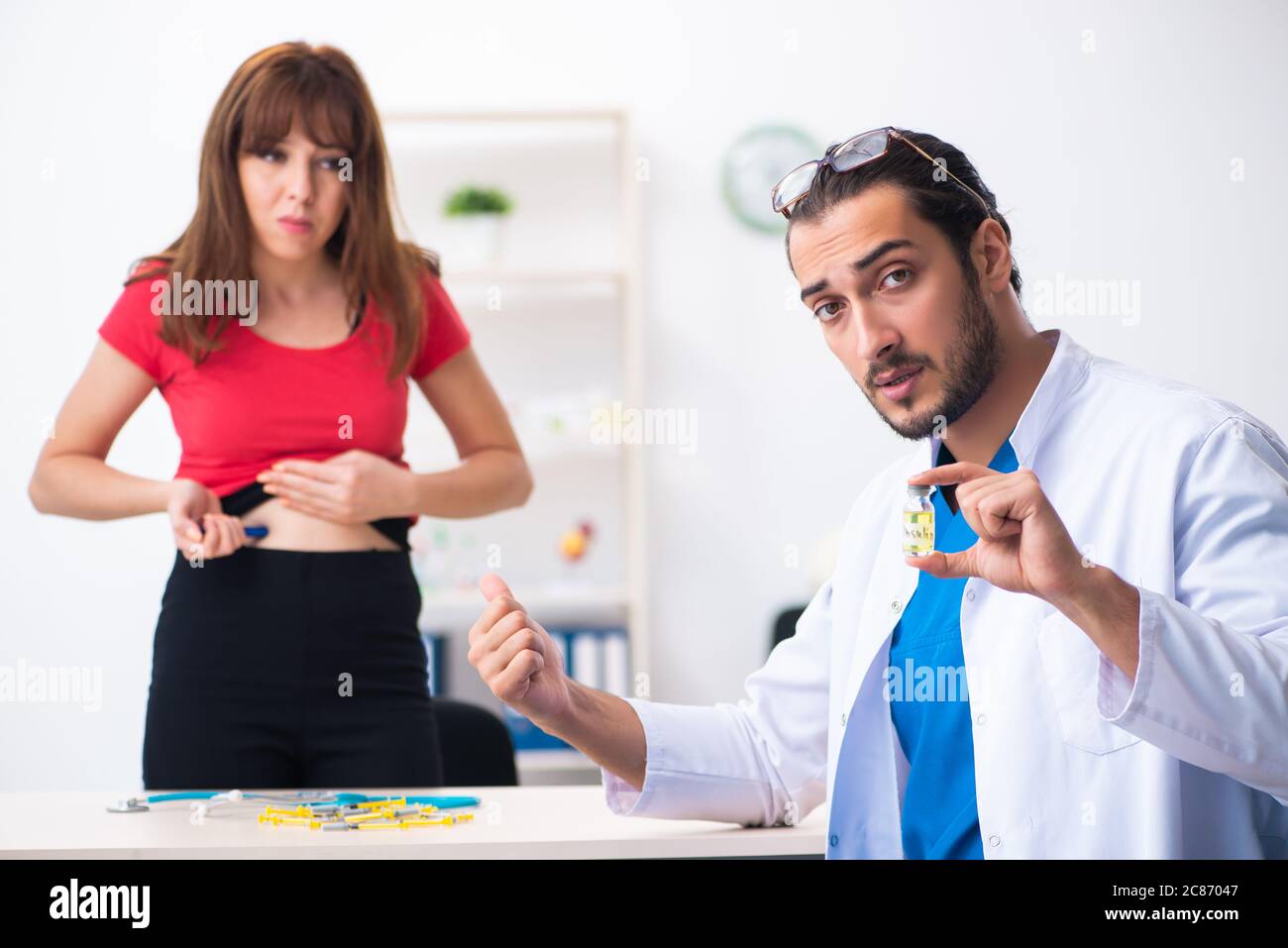 Female diabetic patient visiting young doctor Stock Photo - Alamy