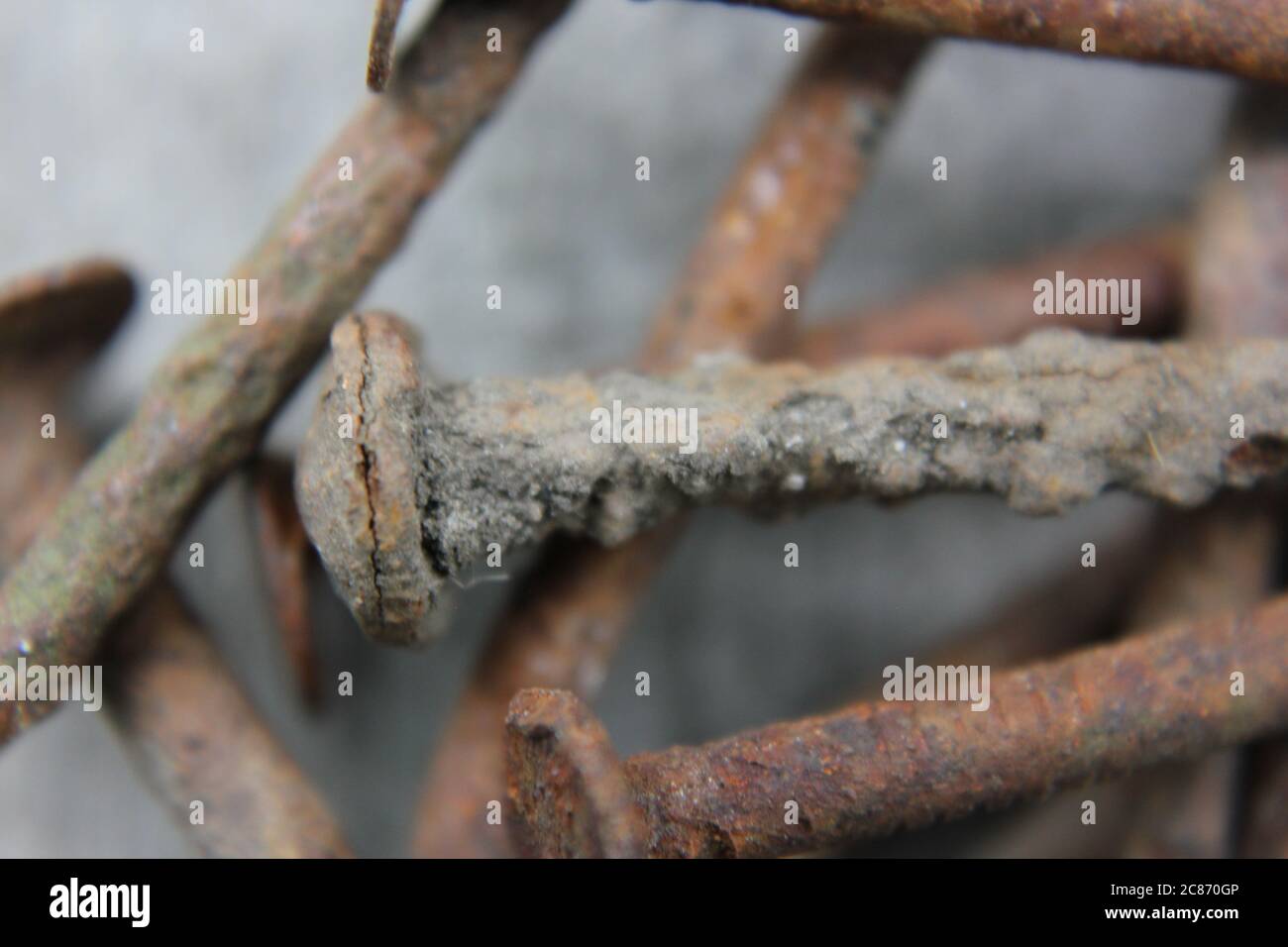 A pile of worn, rusted and out of date iron construction nails Stock ...