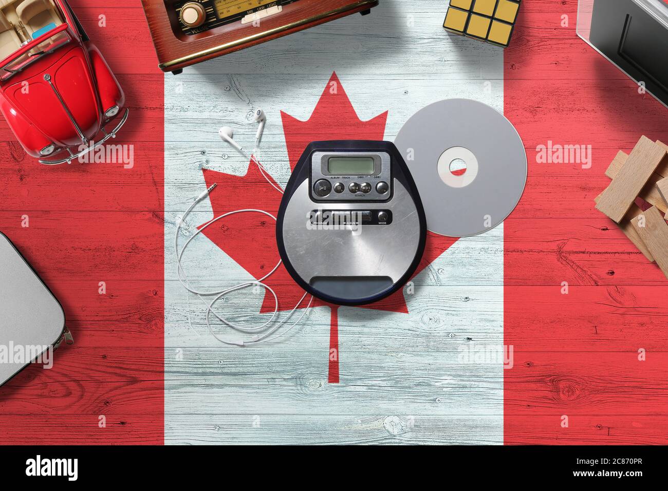 Canada flag on wooden desk with retro digital media concept. National ...