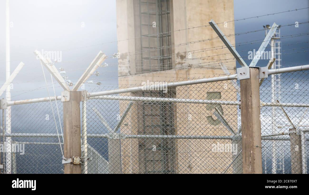 Close Up Prison Fences And Barbed Wire And Prison Tower Criminal ...