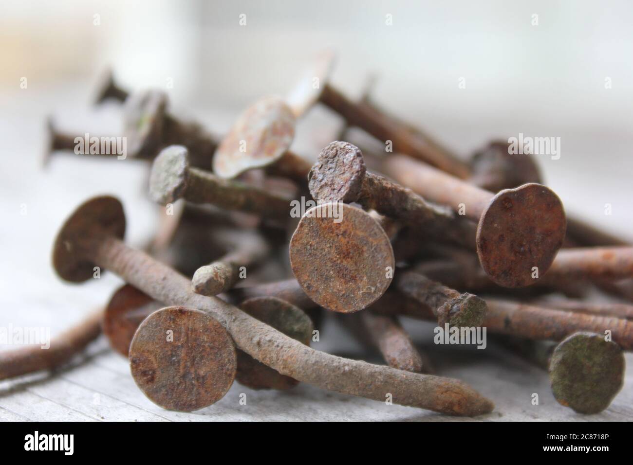 A pile of worn, rusted and out of date iron construction nails Stock ...