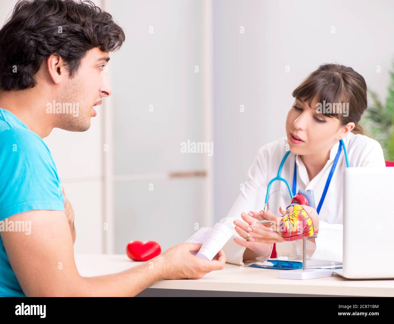 The young patient visiting doctor cardiologist Stock Photo - Alamy