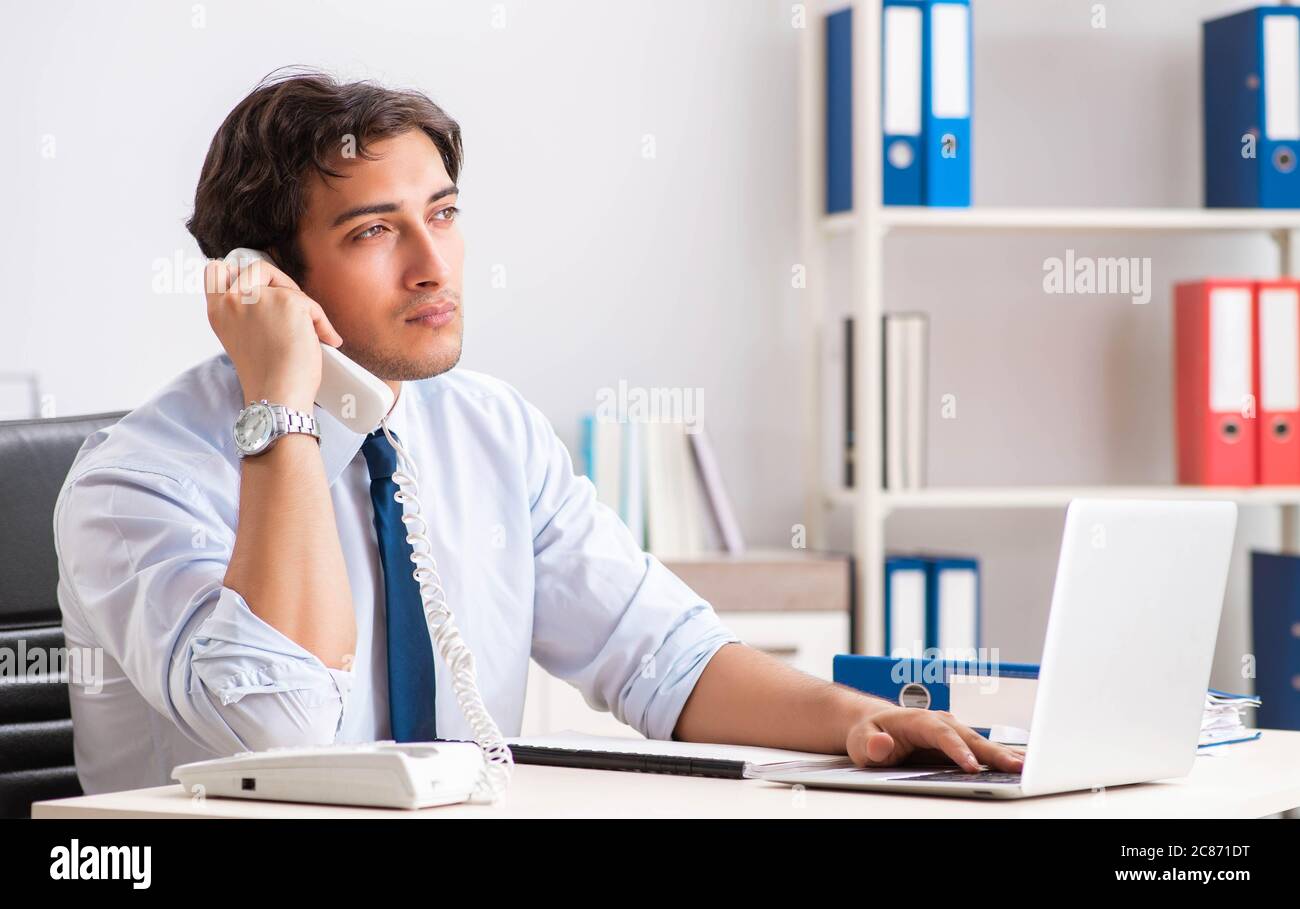 The young call center operator speaking on phone Stock Photo - Alamy