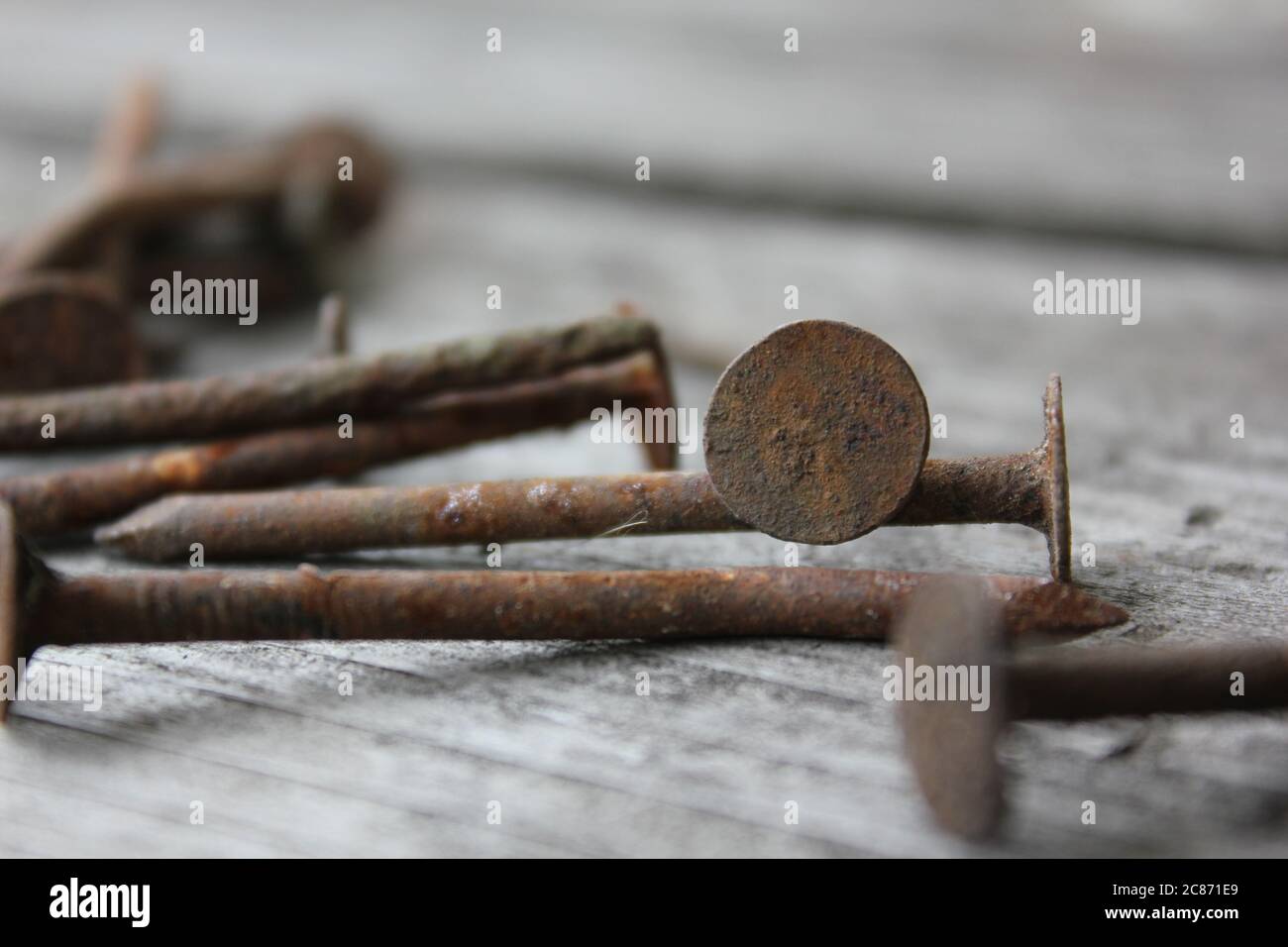 A pile of worn, rusted and out of date iron construction nails Stock ...