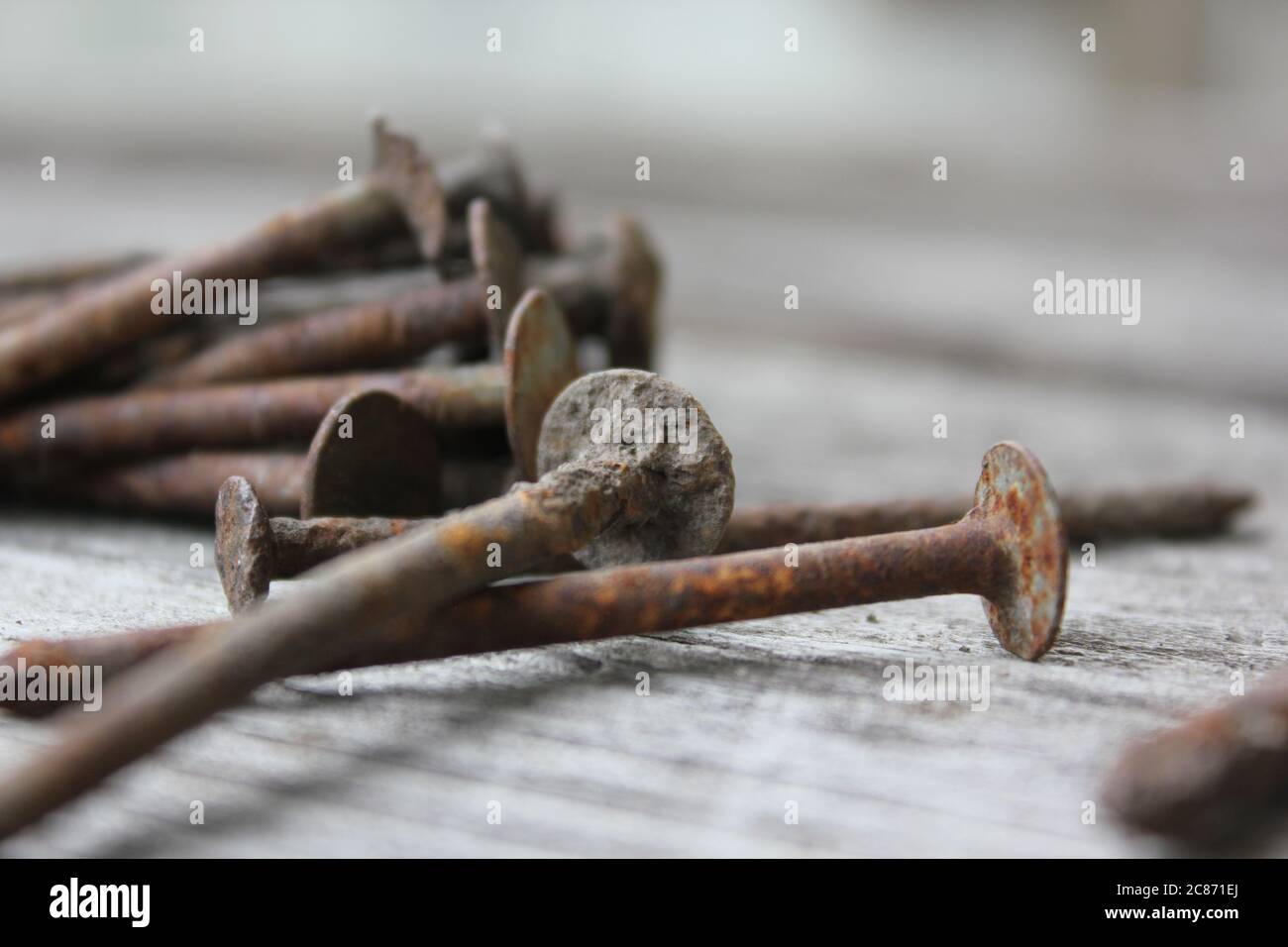 A pile of worn, rusted and out of date iron construction nails Stock ...