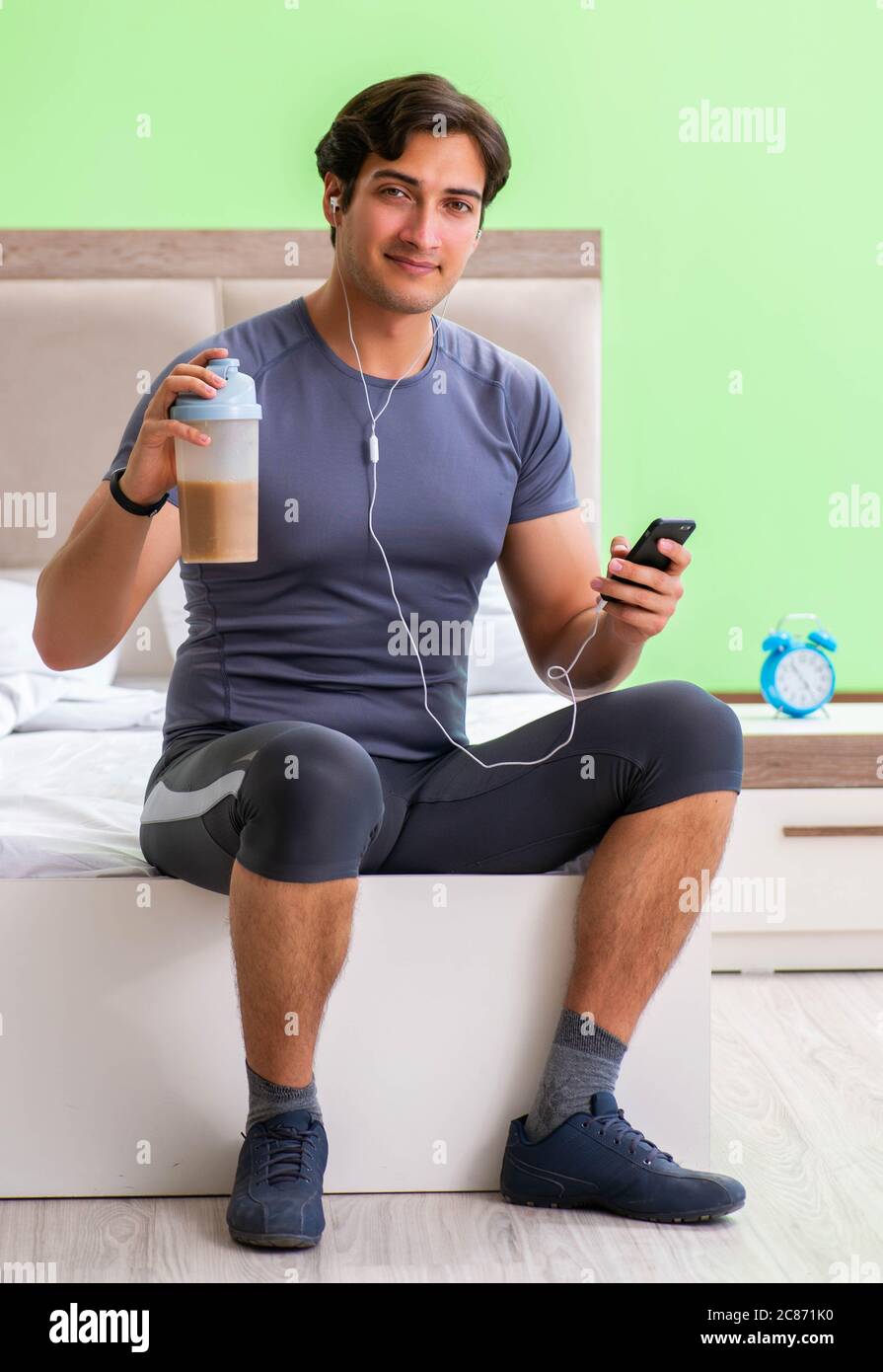 The young handsome man doing morning exercises in the hotel room Stock ...
