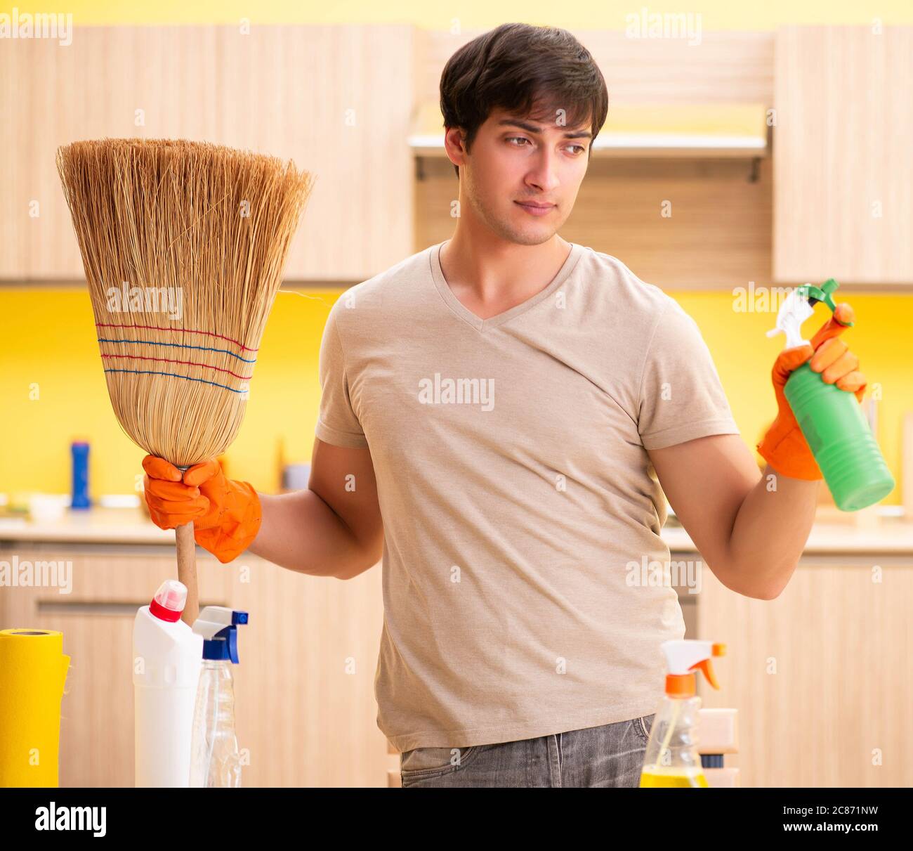The single man cleaning kitchen at home Stock Photo - Alamy