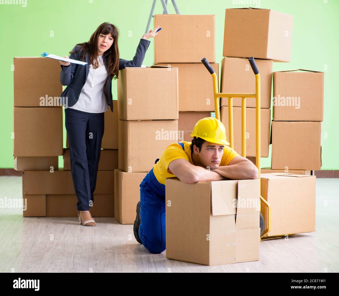 The woman boss and man contractor working with boxes delivery Stock ...