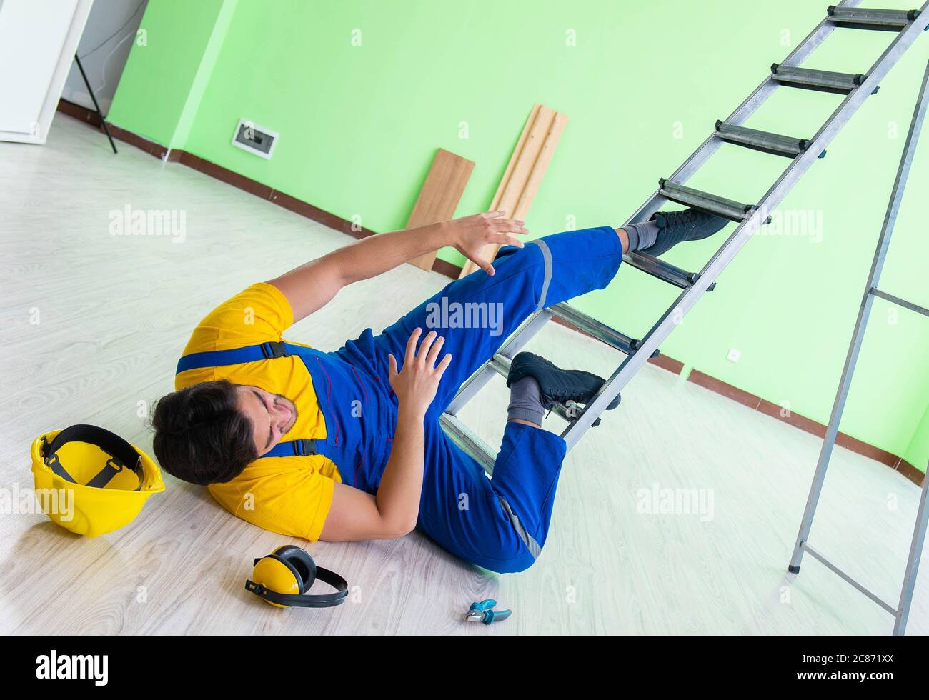 The injured worker at the work site Stock Photo - Alamy
