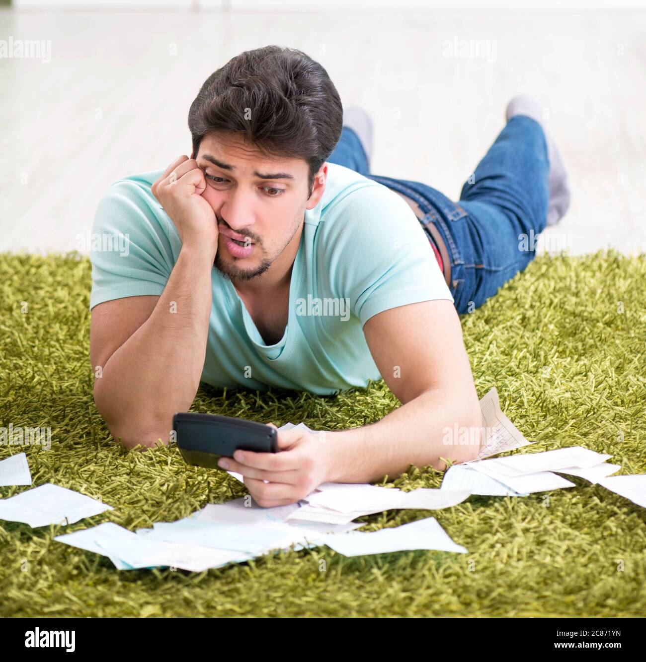 The young man struggling with personal finance and bills Stock Photo ...