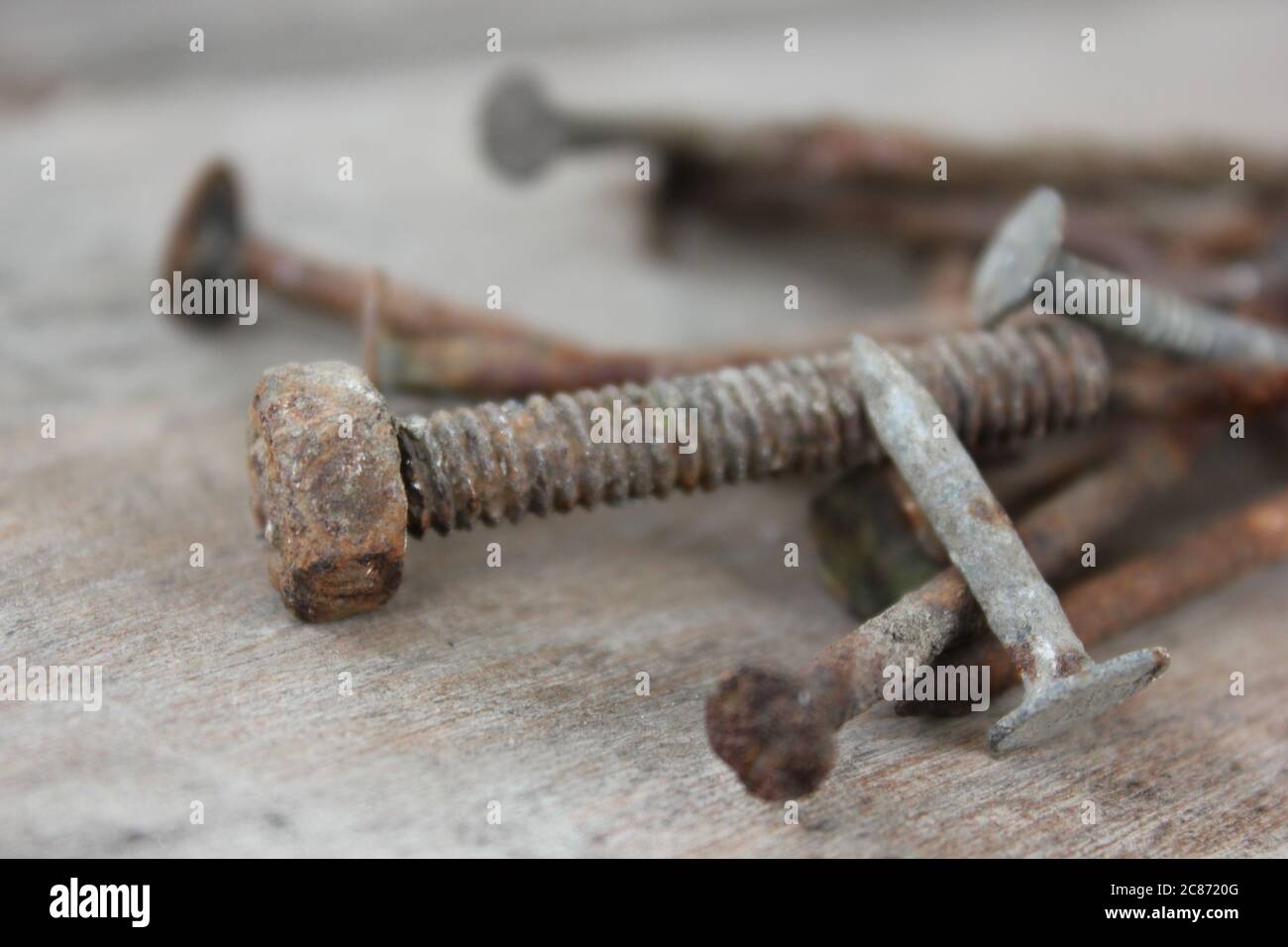 A pile of worn, rusted and out of date iron construction nails Stock ...