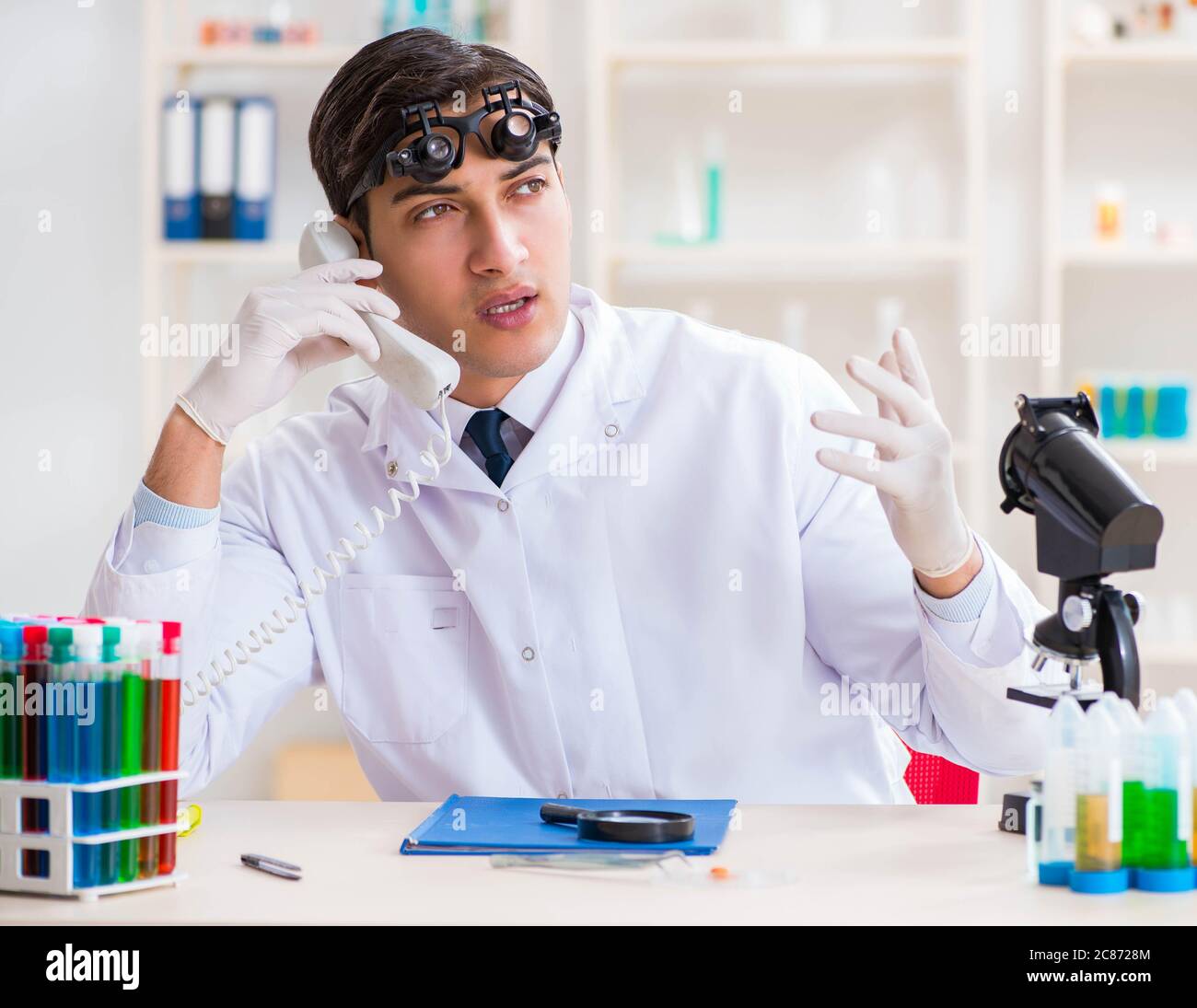 The young chemical scientist working in lab Stock Photo - Alamy