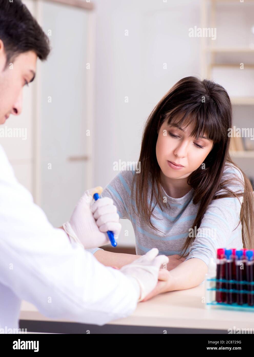 The patient during blood test sampling procedure taken for analysis ...