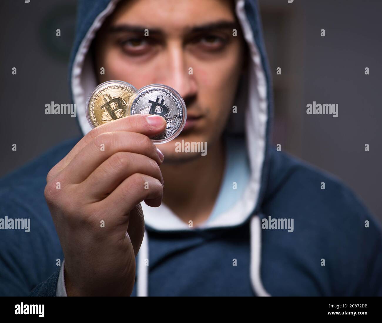 The young man in bitcoin mining concept Stock Photo - Alamy