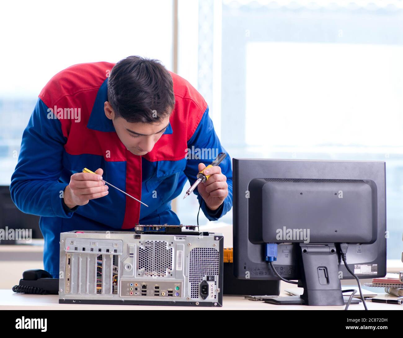 The computer repairman specialist repairing computer desktop Stock ...
